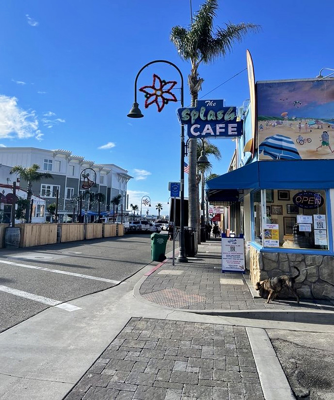 Street view perfection: palm trees, ocean air, and a neon sign pointing the way to chowder heaven.