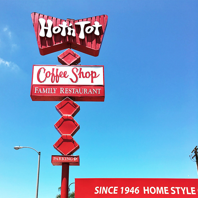 That vintage sign has guided hungry travelers for generations. Mid-century design meets breakfast necessity in perfect harmony.