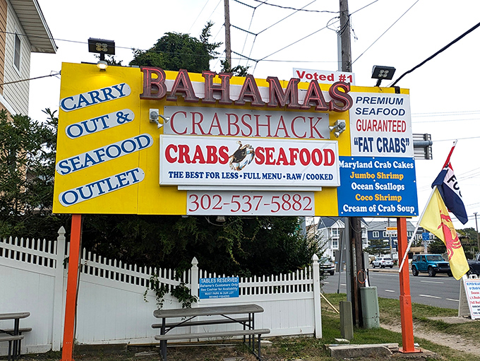 The sign that launched a thousand seafood pilgrimages. "The Best For Less" isn't just marketing&mdash;at Bahama's Crabshack, it's a solemn promise.