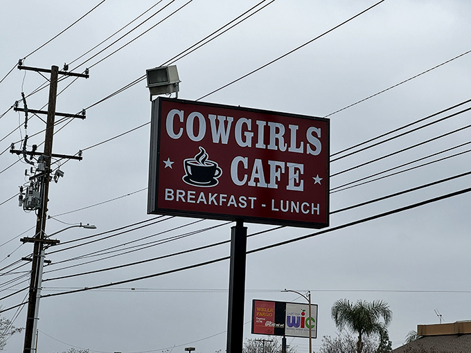 The roadside sign stands as a beacon for breakfast pilgrims. Like a lighthouse guiding hungry sailors to safe harbor, it promises satisfaction just ahead.