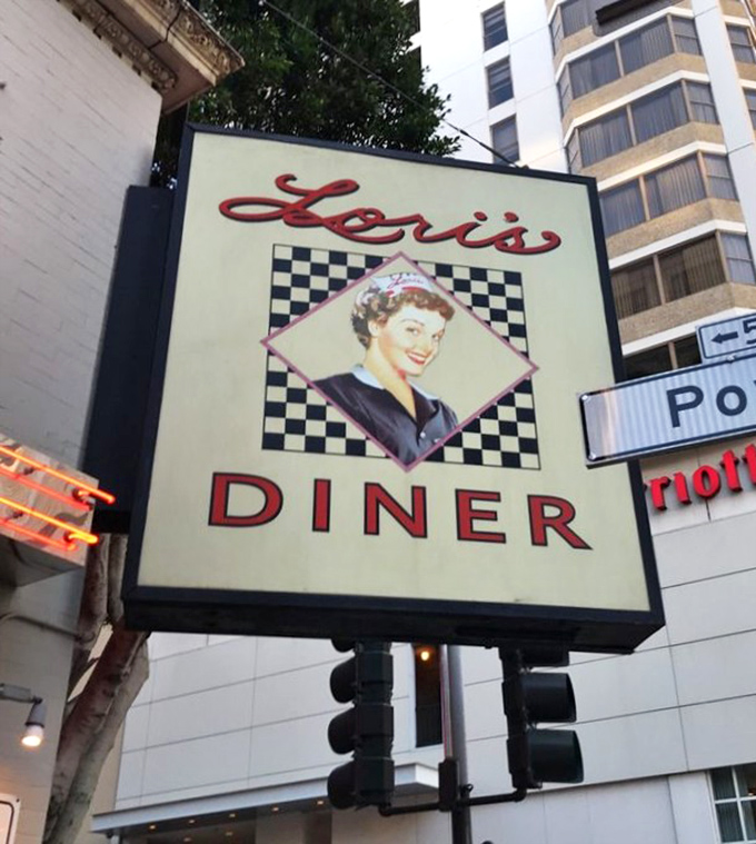 Even the street sign whispers promises of the comfort food paradise waiting just steps away.