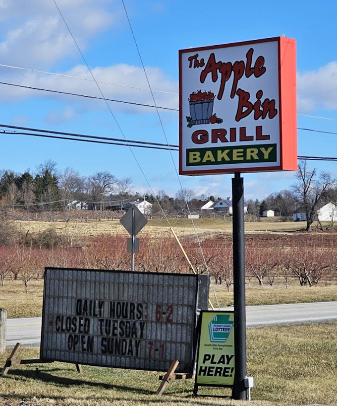 The sign that's guided hungry travelers for years, standing sentinel against the backdrop of the very orchards that inspire their apple-centric specialties.
