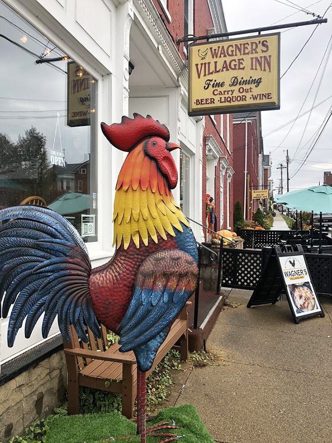 This colorful rooster statue announces Wagner's presence with pride, promising poultry perfection awaits inside this culinary treasure.