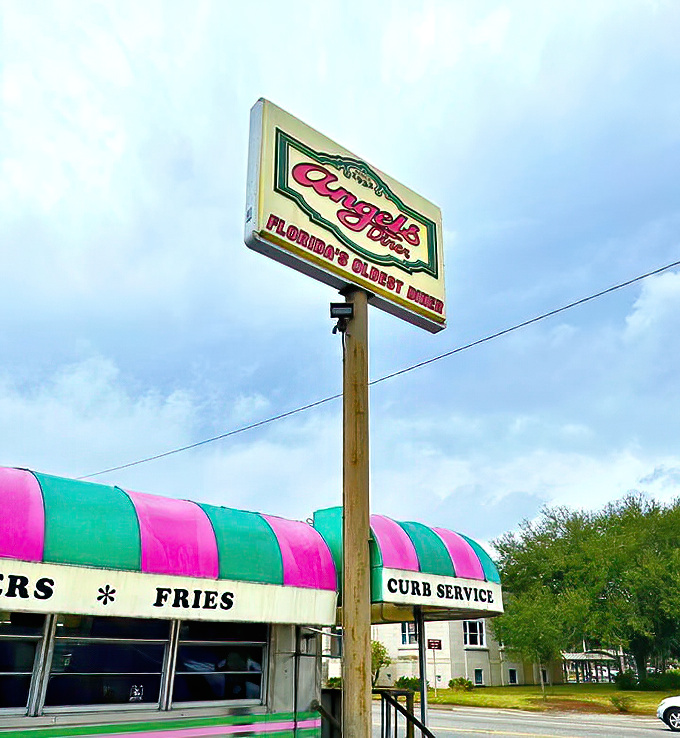 The sign stands tall like a sentinel of satisfaction, promising comfort food that delivers on that promise with every bite.