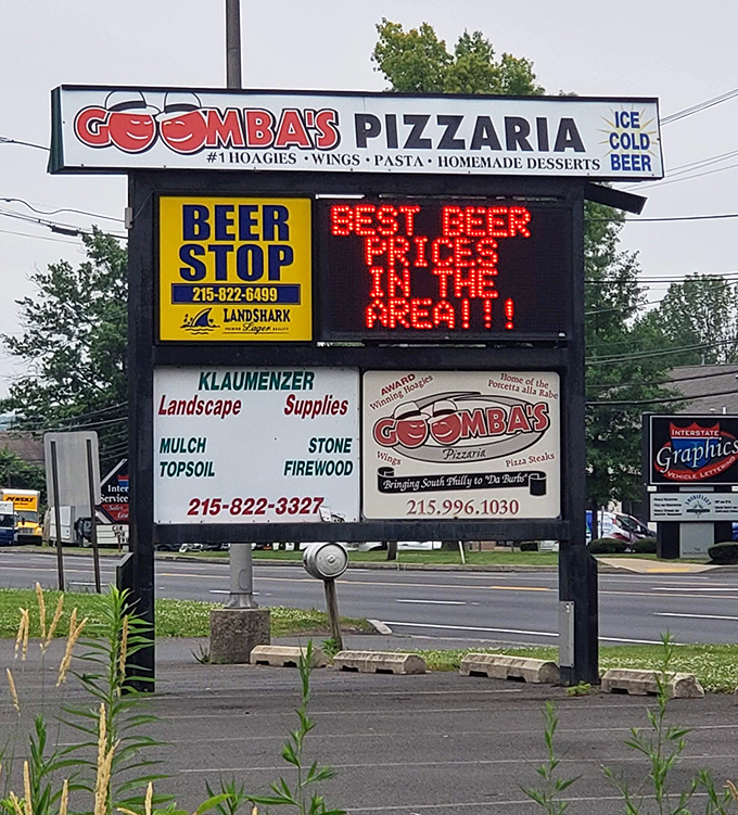 The roadside sign doesn't mince words: "#1 HOAGIES" isn't bragging if it's true, and those "BEST BEER PRICES" seal the deal.