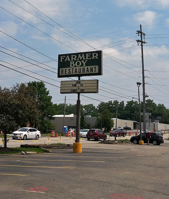 The roadside sign promising two essential services: "Dine In" and "Carry Out"&mdash;both leading to the same delicious destination.