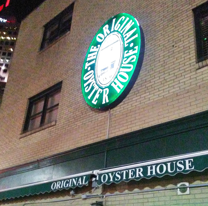 By night, the glowing green sign serves as a lighthouse for hungry souls navigating downtown Pittsburgh in search of seafood salvation.