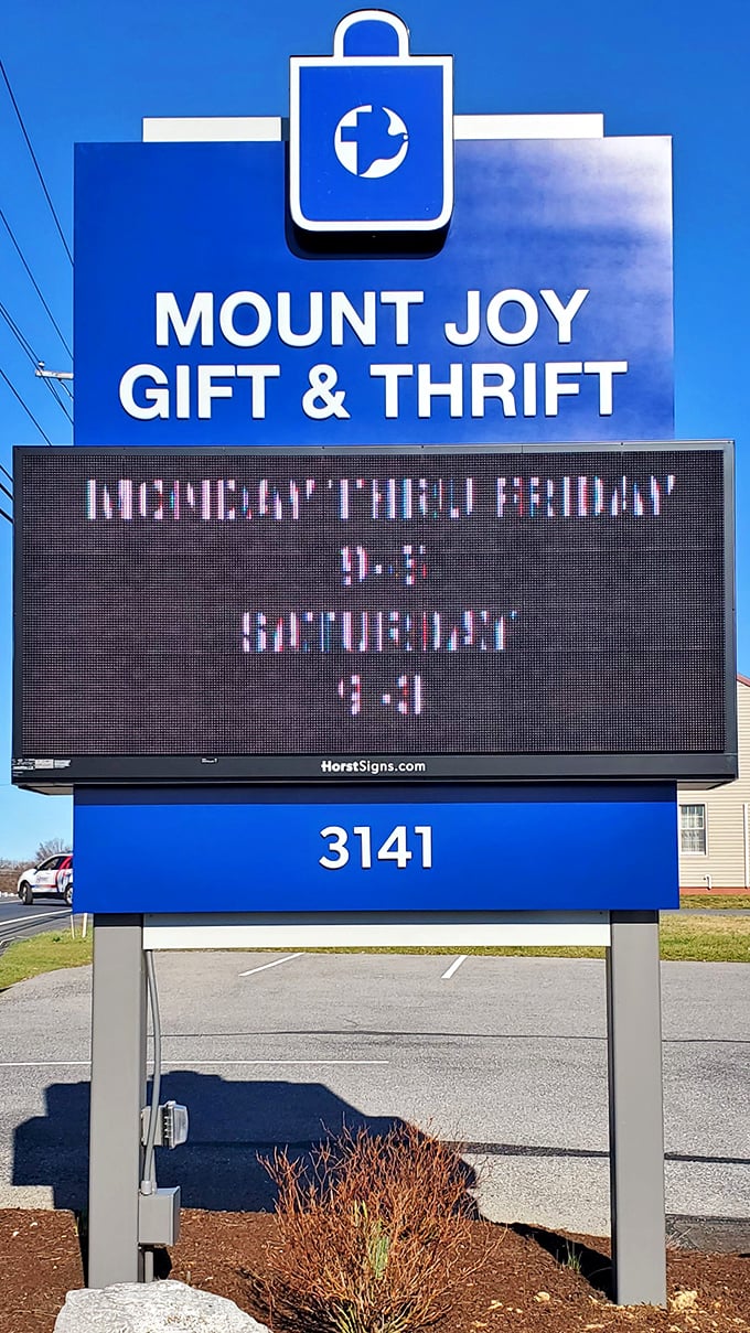 The iconic blue sign beckons thrift enthusiasts like a lighthouse guiding ships to treasure-filled shores. Bonus: check those hours!