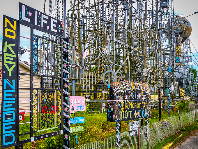 Colorful signs and messages woven throughout the metal framework add personal touches to this monumental artistic achievement.