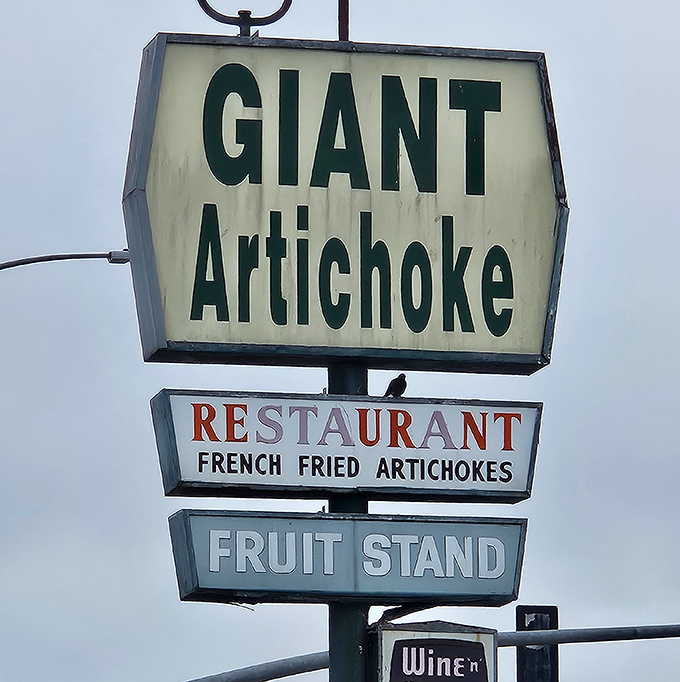 The beacon that's saved many a hungry traveler. This vintage sign has guided artichoke pilgrims for generations&mdash;promising fried delights and fruity treasures below.