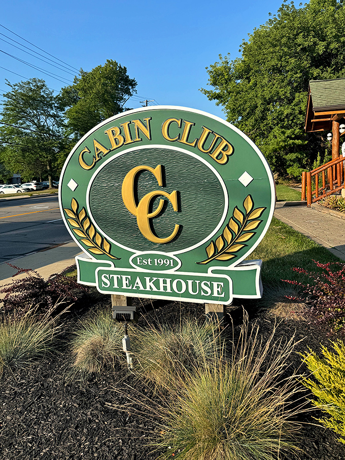 This isn't just a sign&mdash;it's a promise of the experience waiting inside. The landscaping sets the stage for the culinary performance to come.