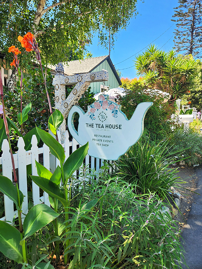 The teapot sign stands guard among the greenery, a whimsical sentinel announcing you've found the right place for proper tea.