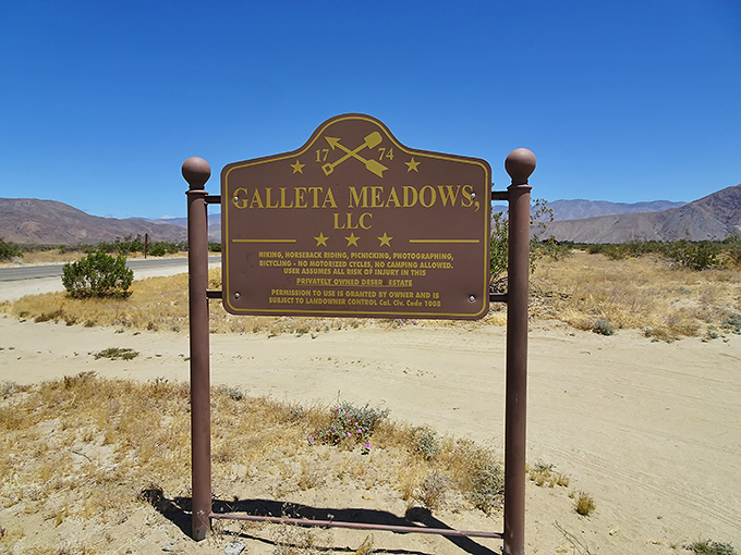 The unassuming entrance sign to an extraordinary experience – like finding the door to Narnia in the back of a desert closet.