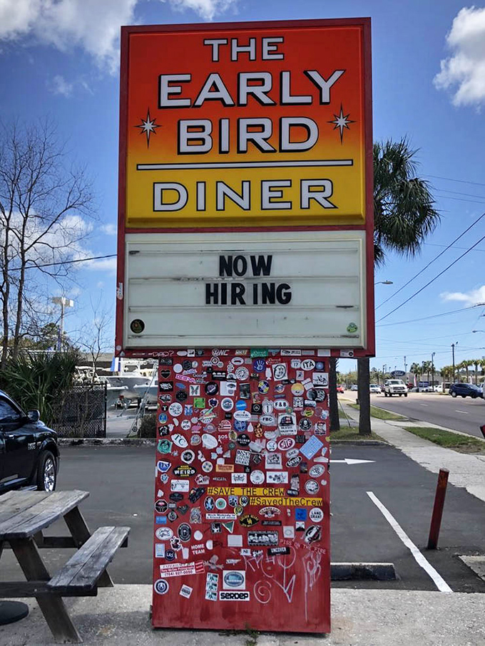 A sign that's become as iconic as what's served inside. That sticker-covered base tells the story of countless pilgrims who've made the journey to this diner shrine.