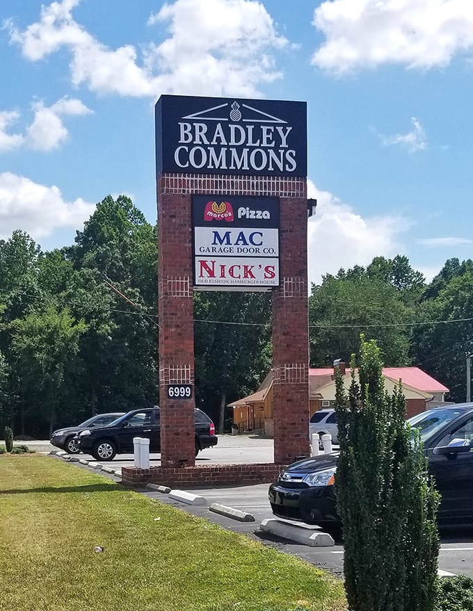 Nestled in Bradley Commons, Nick's sign stands as a beacon of hope for the burger-deprived traveler seeking salvation between two buns.