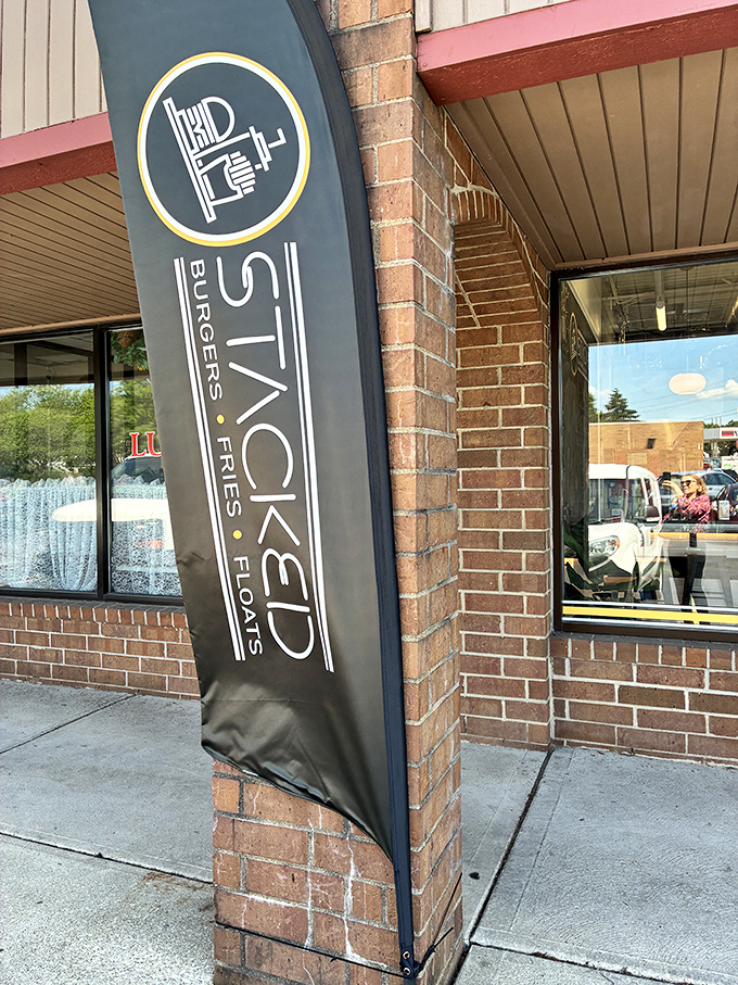 The Stacked banner stands tall, a beacon of hope for the hungry and a flag planted firmly in burger territory.