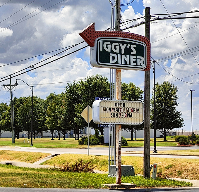 The vintage arrow sign points the way to happiness&mdash;operating hours included because good things shouldn't be kept waiting.