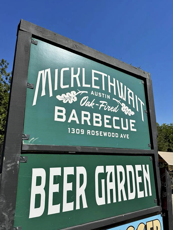 This sign doesn't just mark a location—it's a beacon of hope for the barbecue pilgrim seeking oak-fired salvation.