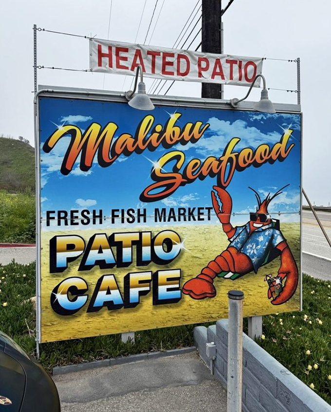 The sign promises three essential things: fresh fish market, patio caf&eacute;, and heated patio. In Malibu, that's all you really need.