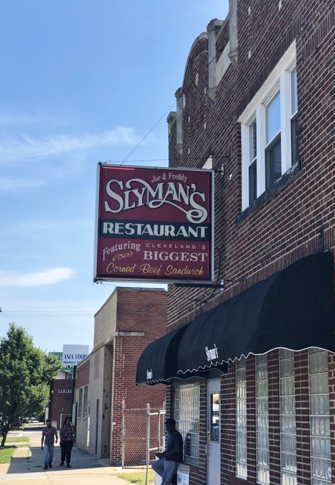 The street-facing sign proudly announces "Cleveland's BIGGEST Corned Beef Sandwich"—not an empty boast but a measurable, delicious fact.