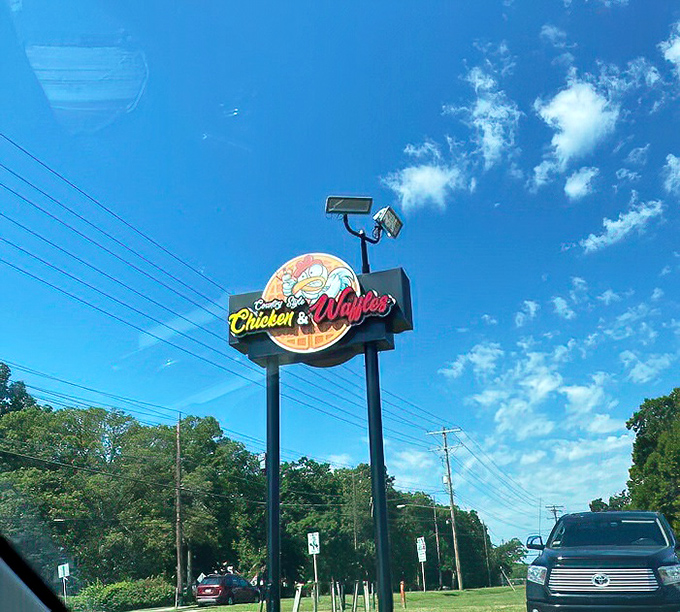 This sign against the blue Maryland sky isn't just advertising&mdash;it's a promise of happiness that's just a turn signal away.