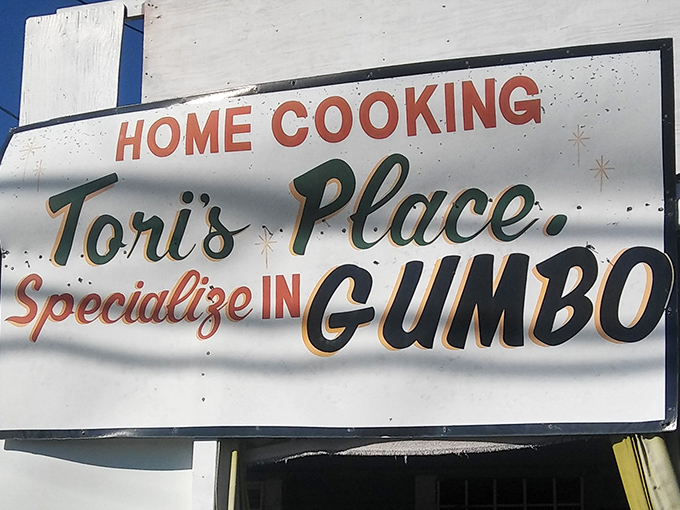That sign says it all: "HOME COOKING" and "Specialize in GUMBO." Six simple words that promise everything you need to know about the deliciousness waiting inside.