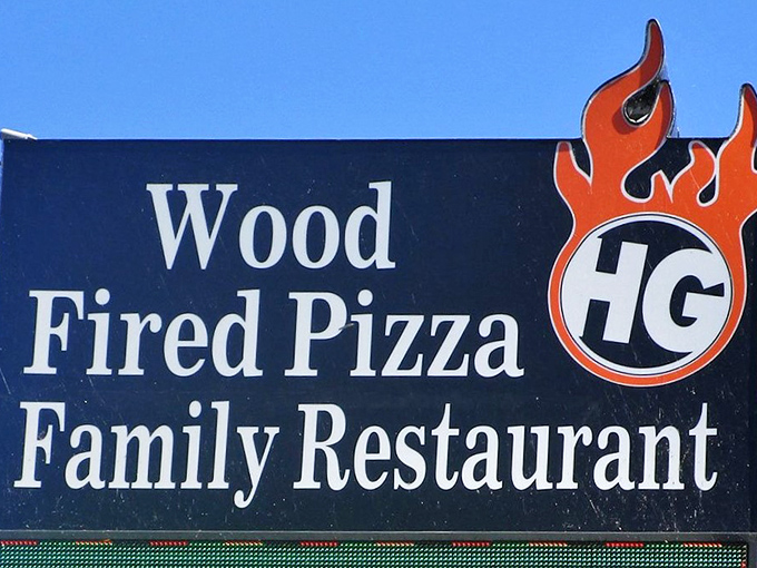 The sign says it all&mdash;wood-fired pizza with flames that promise food cooked with both fire and passion. 