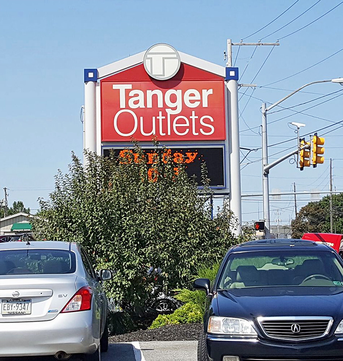 The iconic Tanger sign stands tall, a beacon of hope for shoppers seeking retail therapy without the sticker shock aftermath.
