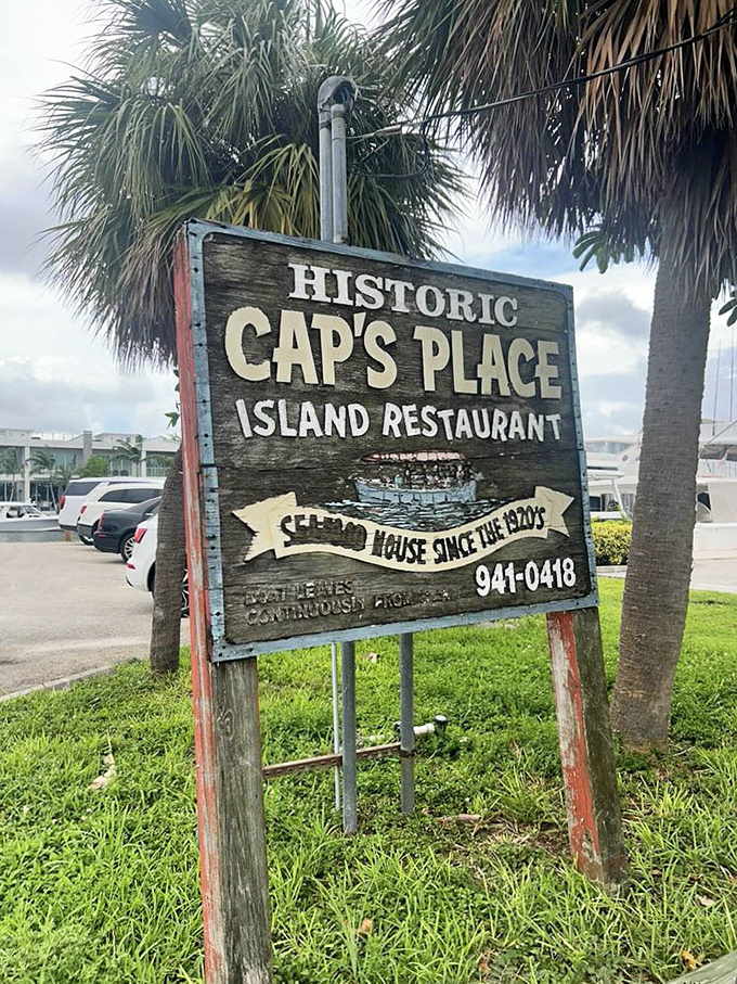 The weathered sign stands as a proud sentinel, announcing to passersby that they've found one of Florida's true historic treasures.