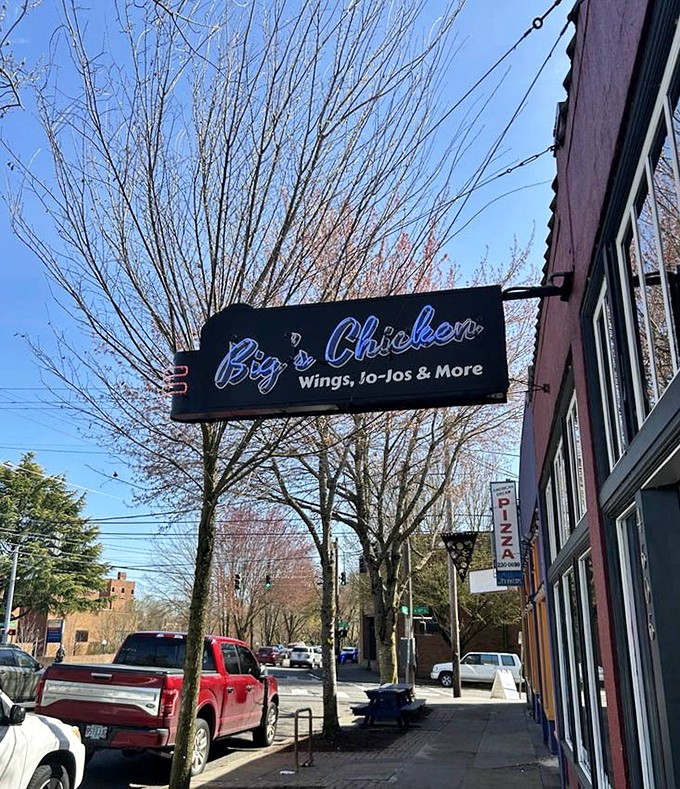 That blue neon sign against the red building is like a lighthouse for the hungry. "Wings, Jo-Jos & More" might be the most beautiful poetry in Portland.