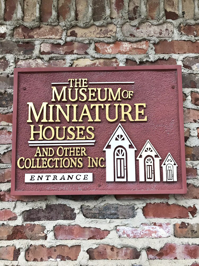 The sign says it all—this isn't just about dollhouses. It's a celebration of the extraordinary skill it takes to create perfect miniature worlds.