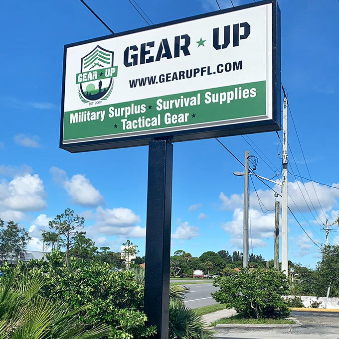 The sign that launched a thousand expeditions – promising military surplus, survival supplies, and the tactical gear you never knew you needed until now.