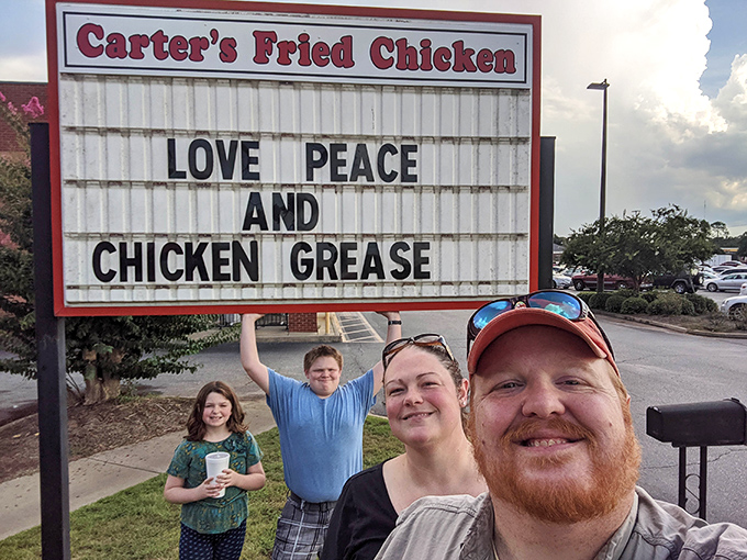 "Love, Peace and Chicken Grease" isn't just a cute sign—it's practically the state motto for Georgia's fried chicken enthusiasts.