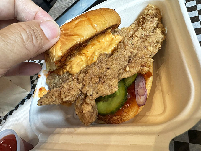 The hot chicken sandwich that makes you question your spice tolerance while simultaneously reaching for another bite. A beautiful relationship of pain and pleasure.