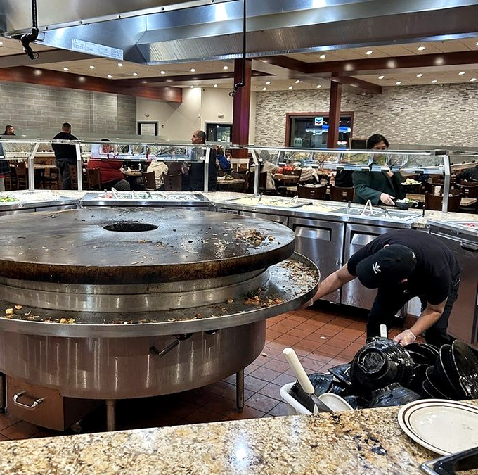 Where the magic happens &ndash; staff tending to the cooking stations ensure fresh offerings throughout your dining experience.