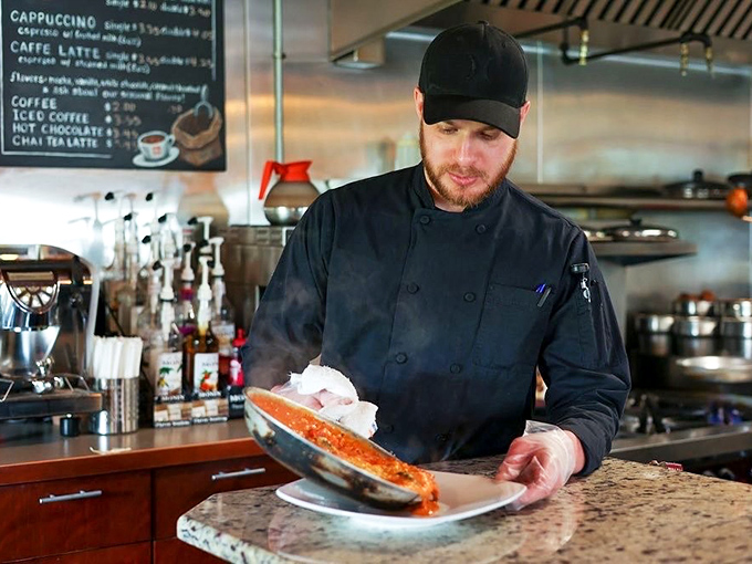 The chef in his natural habitat&mdash;where sauce-making is elevated to an art form that would make Michelangelo trade his paintbrush for a wooden spoon.