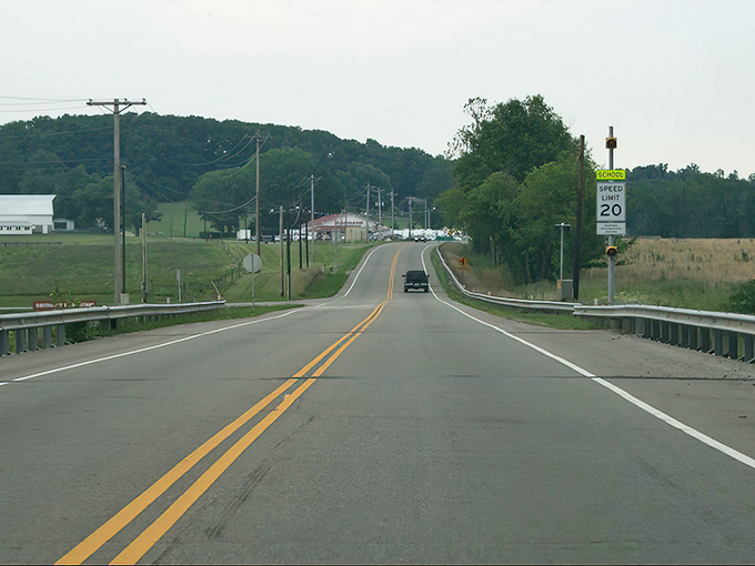 The approach to small-town Ohio, where every rise in the road reveals another postcard-worthy vista that no smartphone camera can truly capture.