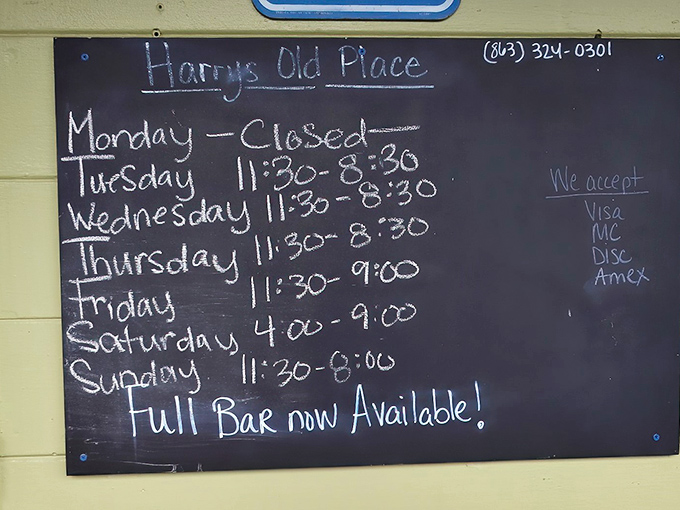 The handwritten hours board&mdash;a charming reminder that the best places march to their own schedule, not corporate mandates. 