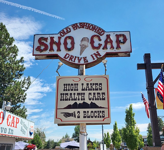 The vintage roadside sign stands as a beacon of hope for hungry travelers&mdash;promising salvation in the form of burgers and ice cream.