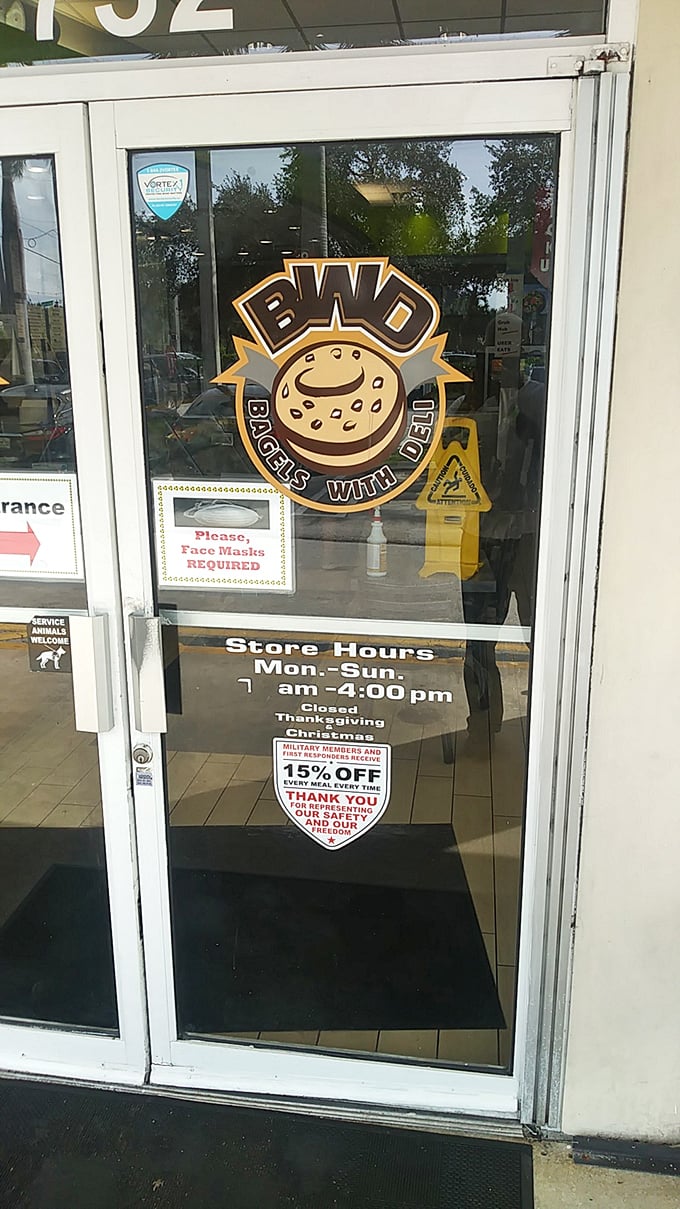 The logo that launches a thousand cravings. The cheerful bagel mascot and posted hours tell you everything you need to know &ndash; come early, come hungry.