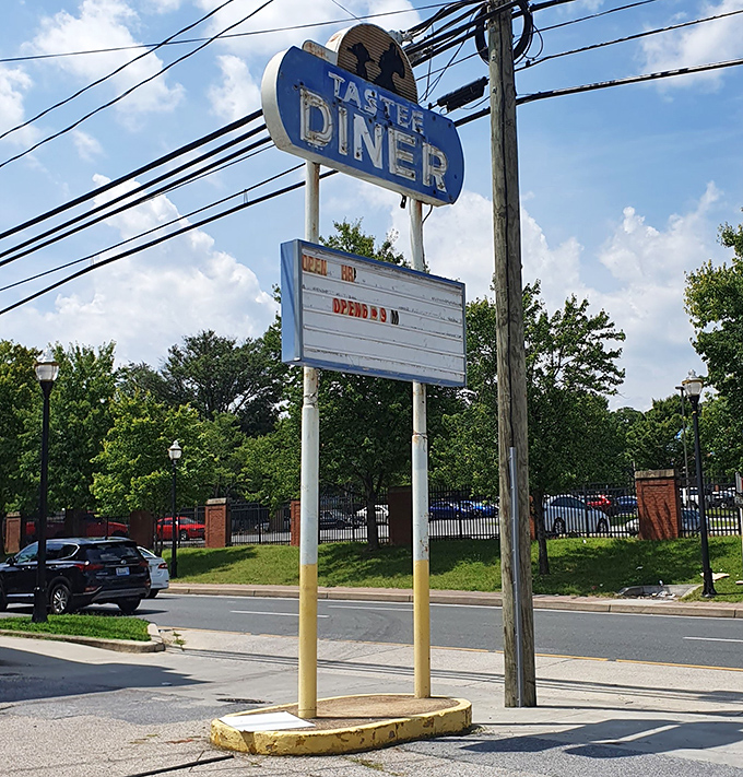 The weathered sign stands as a beacon to breakfast pilgrims&mdash;no fancy digital displays needed when you've been a landmark this long.