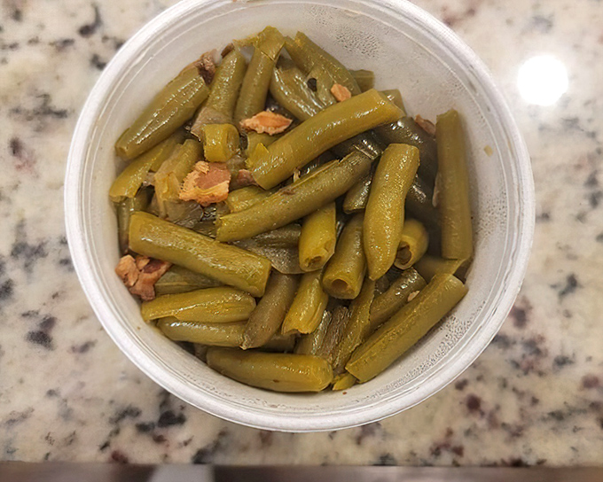 Green beans that haven't been cooked into submission. Still vibrant, with bits of pork adding whispers of smoke to each bite.