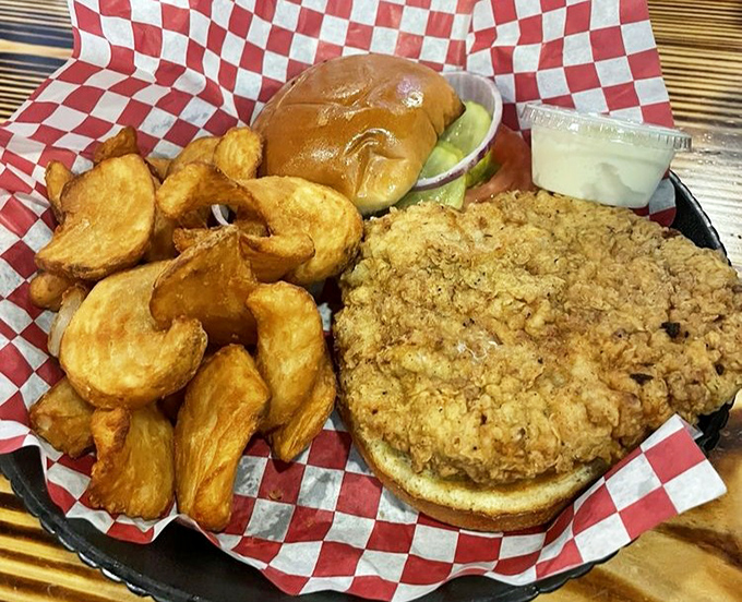 A tenderloin sandwich that requires both hands and possibly a nap afterward. Served with golden fries, it's Indiana comfort on a plate.