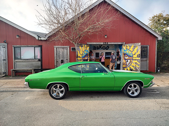 The Biscuit Factory's vibrant exterior and classic muscle car create a time-warp worthy of a Florida road trip detour.