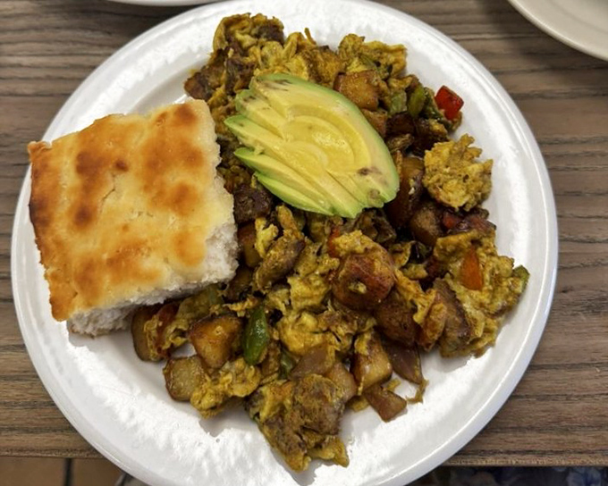 "The Mess" lives up to its name in the most delicious way possible. Scrambled eggs, potatoes, and avocado having the world's tastiest party.