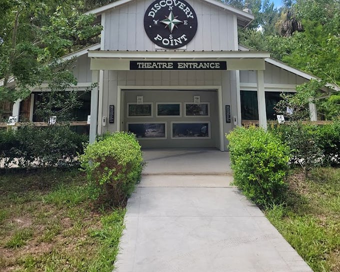 "Discovery Point" promises underwater wonders without getting wet. This theater entrance is the portal to a world where mermaids are real and magic exists.