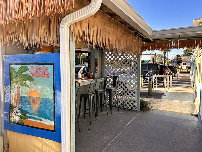 The tiki bar entrance, where palm tree art and thatch roofing announce that you've officially left your worries at the door.