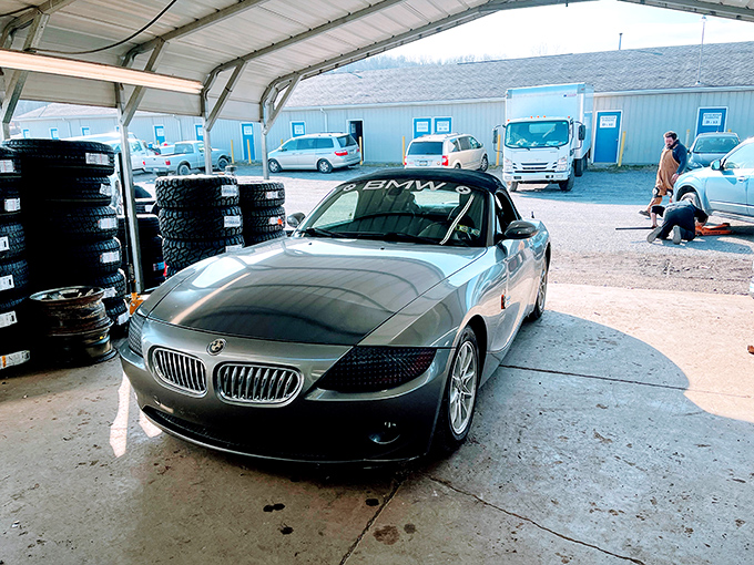 Auto repairs meet antiquing convenience because even treasure hunters need practical services on site.