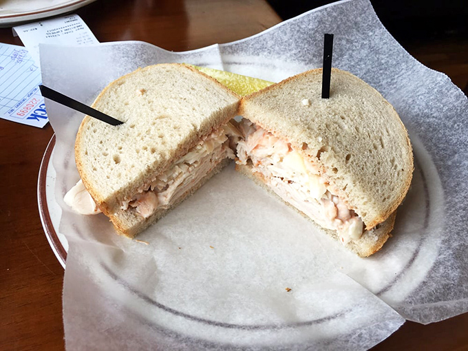 The humble turkey sandwich elevated to art form. Between two slices of bread lies the difference between eating lunch and experiencing it.