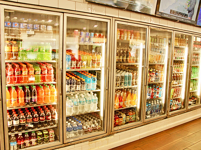 A rainbow of beverages standing at attention, ready to complement your bagel selection with refreshing precision.